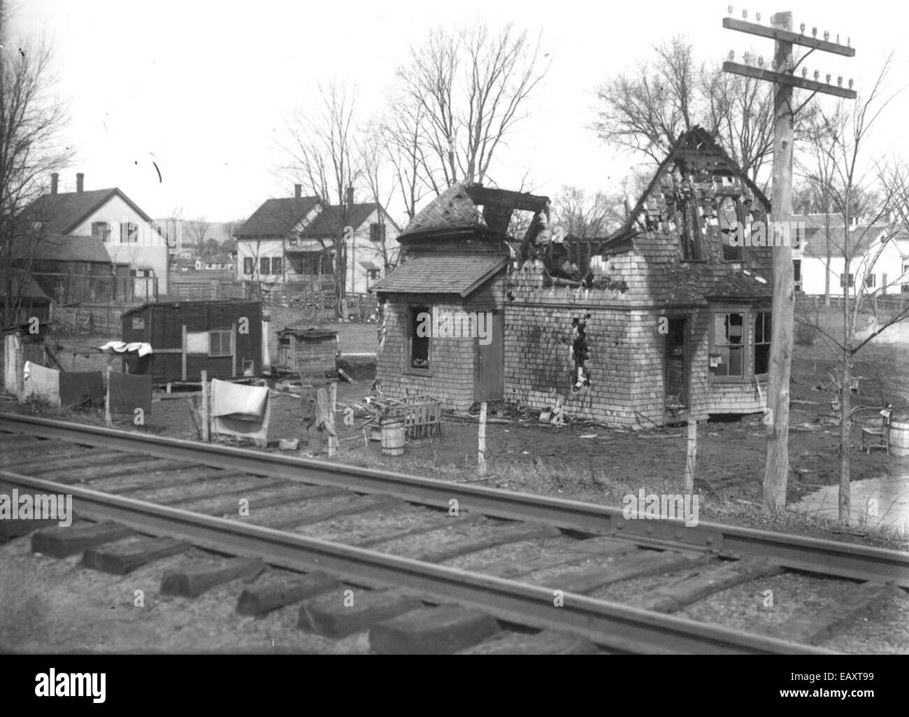 This image shows the aftermath of a fire at a small brick house in ...