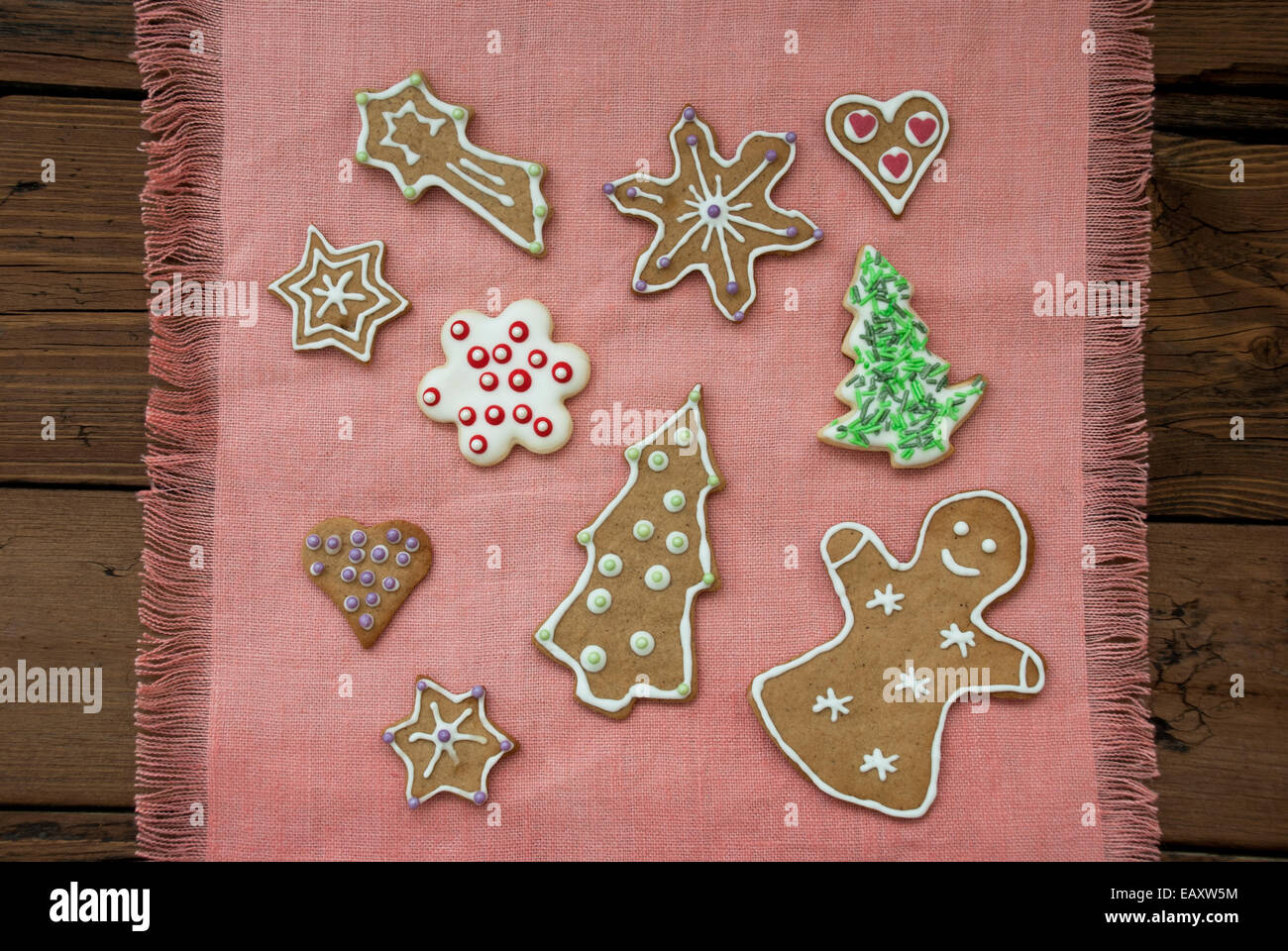 Many Gingerbread Cookies On One Pink Place Mat On Wooden Background ...