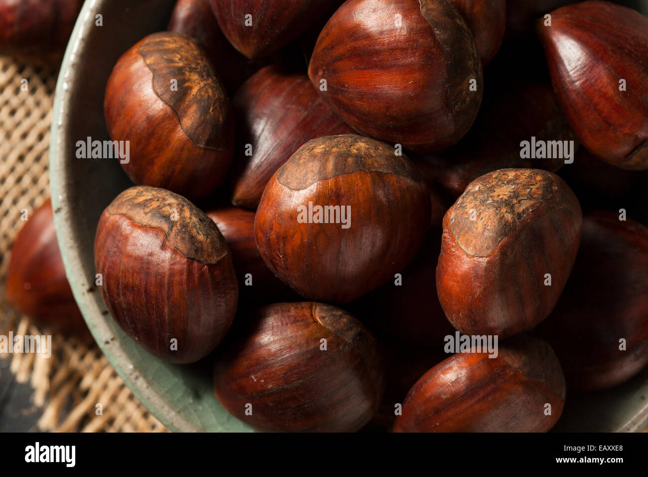 Raw Organic Brown Chestnuts in a Bowl Stock Photo - Alamy