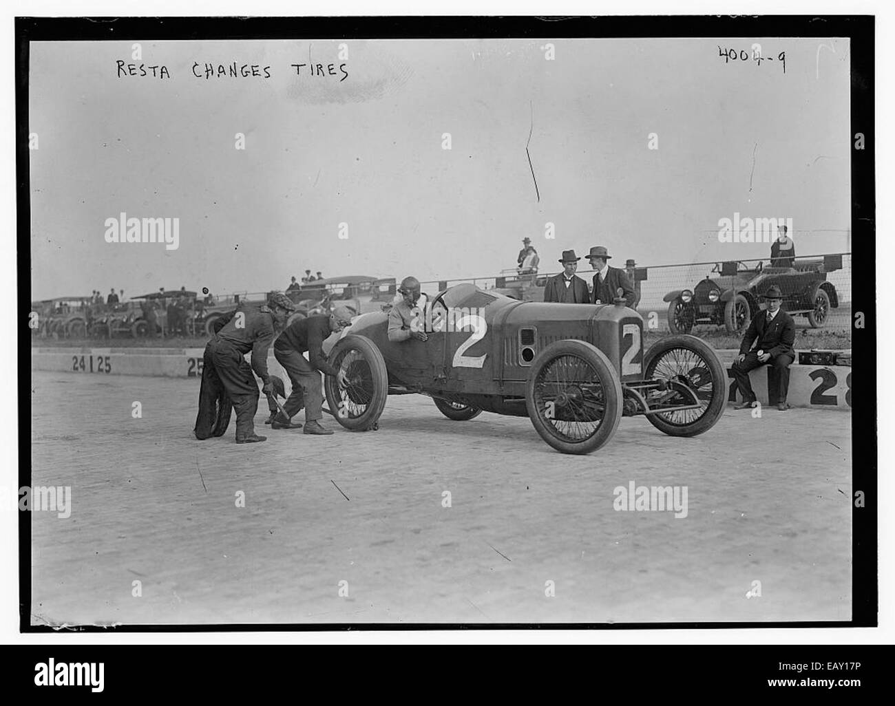 This image captures the moment when Resta changes tires during a race ...