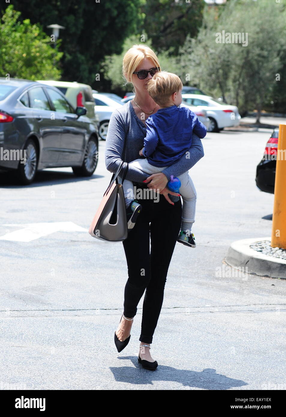 January Jones carries son Xander in her arms while out for lunch at ...