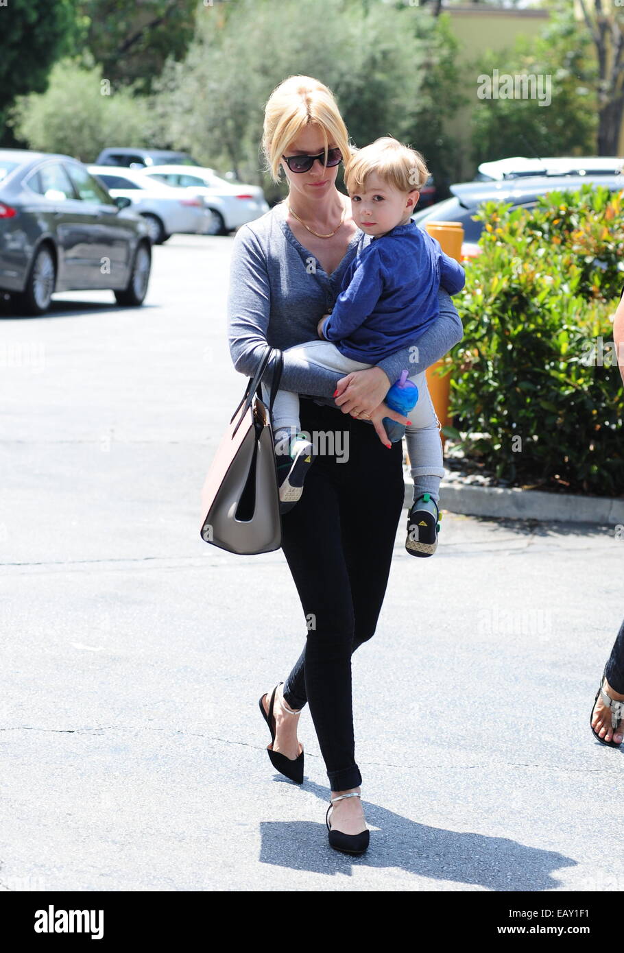 January Jones carries son Xander in her arms while out for lunch at ...