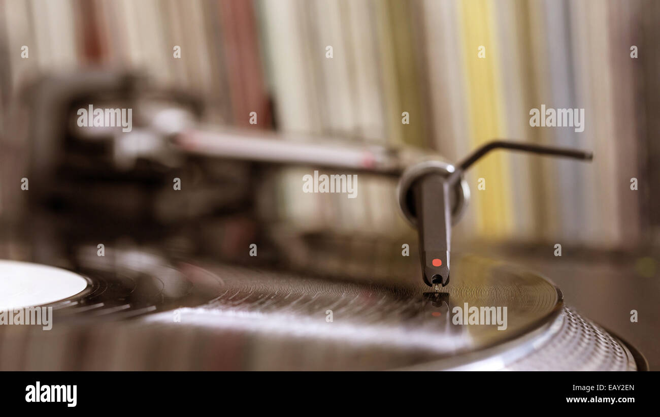 Dj needle stylus on spinning record, vinyl background Stock Photo - Alamy