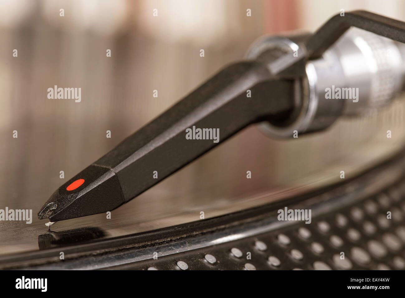 Dj needle stylus on spinning record, vinyl background Stock Photo - Alamy