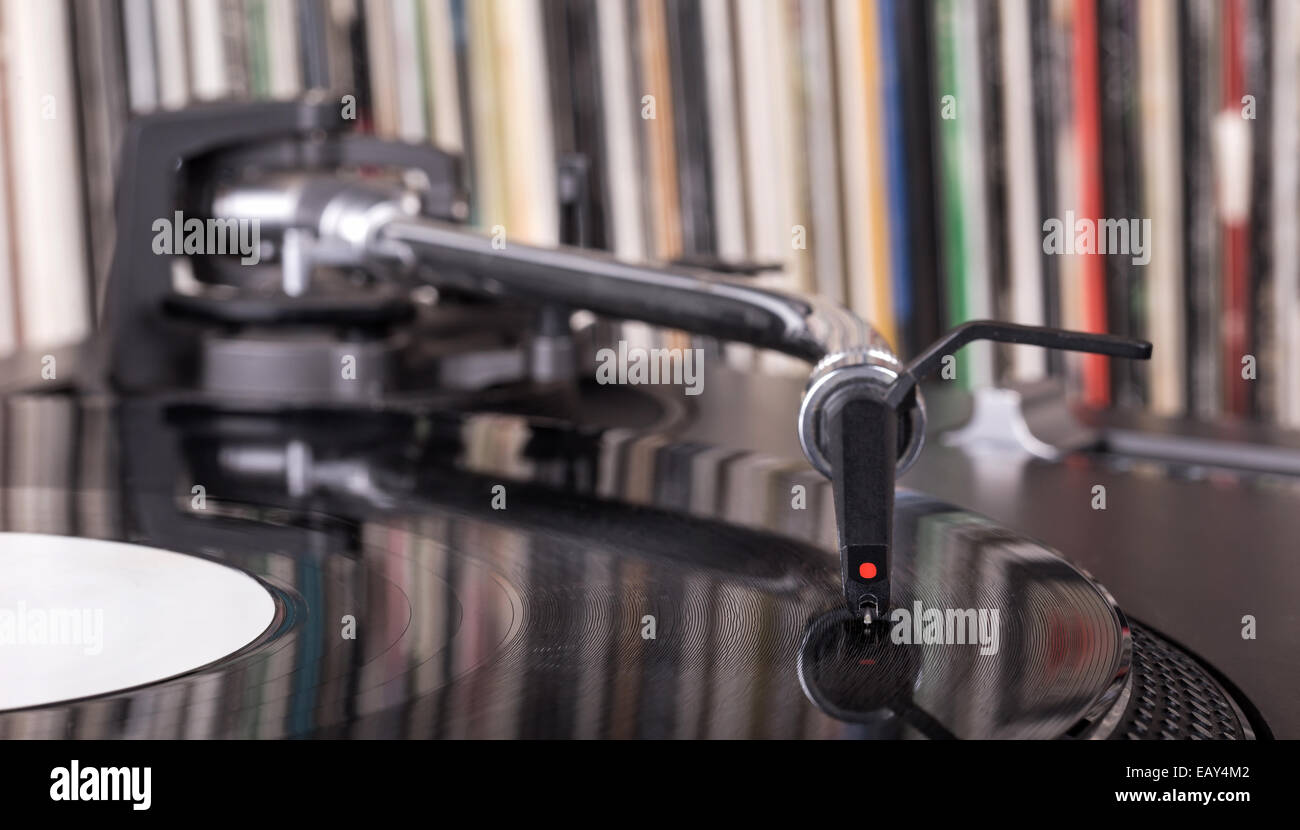 Dj needle stylus on spinning record, vinyl background Stock Photo - Alamy