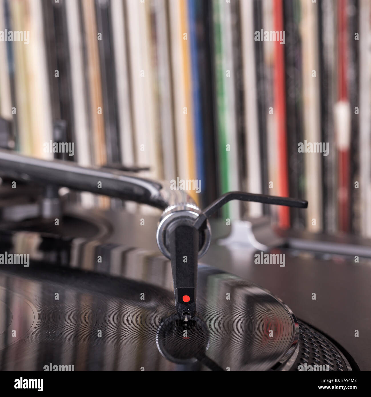 Dj needle stylus on spinning record, vinyl background Stock Photo - Alamy