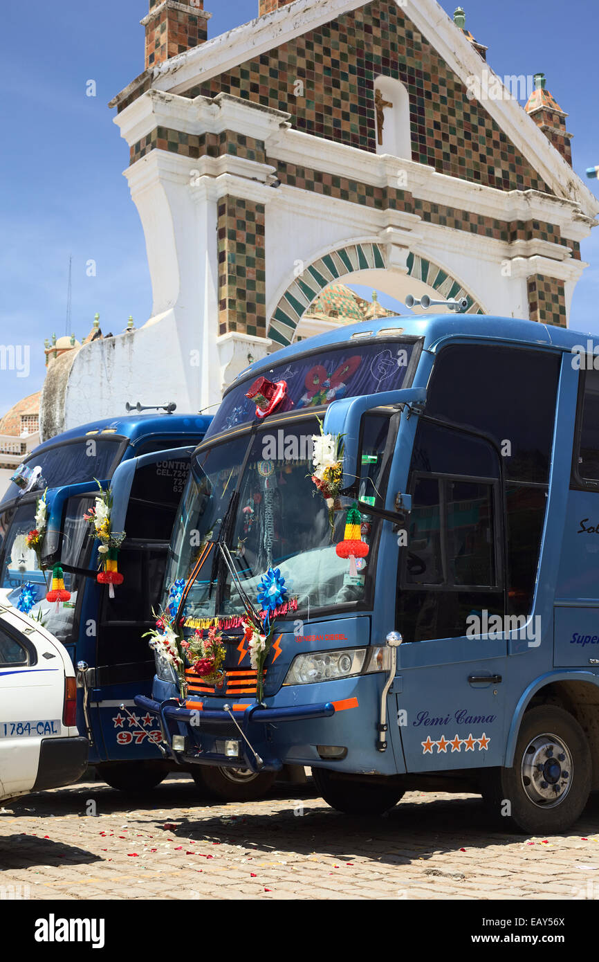 Decorated buses standing in line for the blessing in front of the ...
