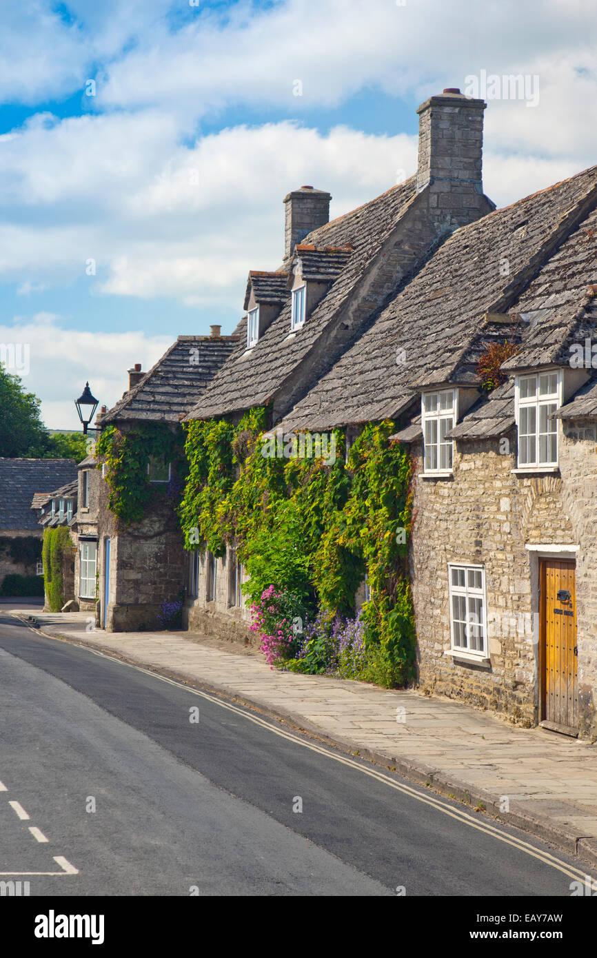 Traditional stone cottages covered in virginia creeper in West Street ...