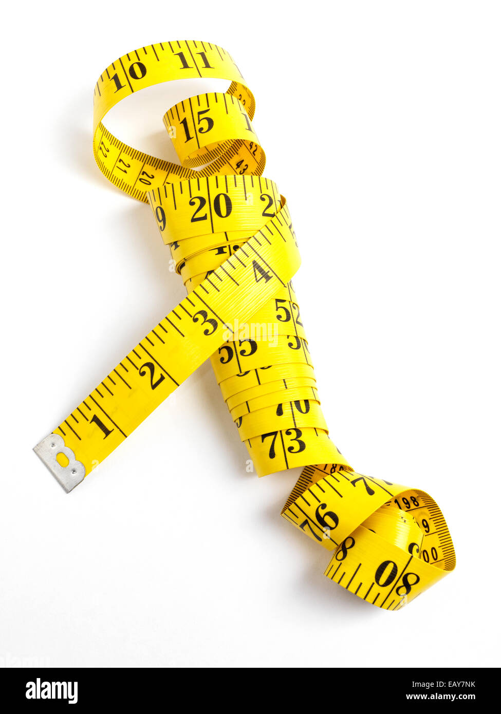 Isolated yellow tape measure on white Stock Photo - Alamy