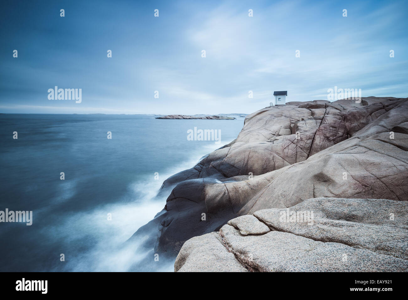 Cabin on cliff near sea with dramatic sky Stock Photo - Alamy