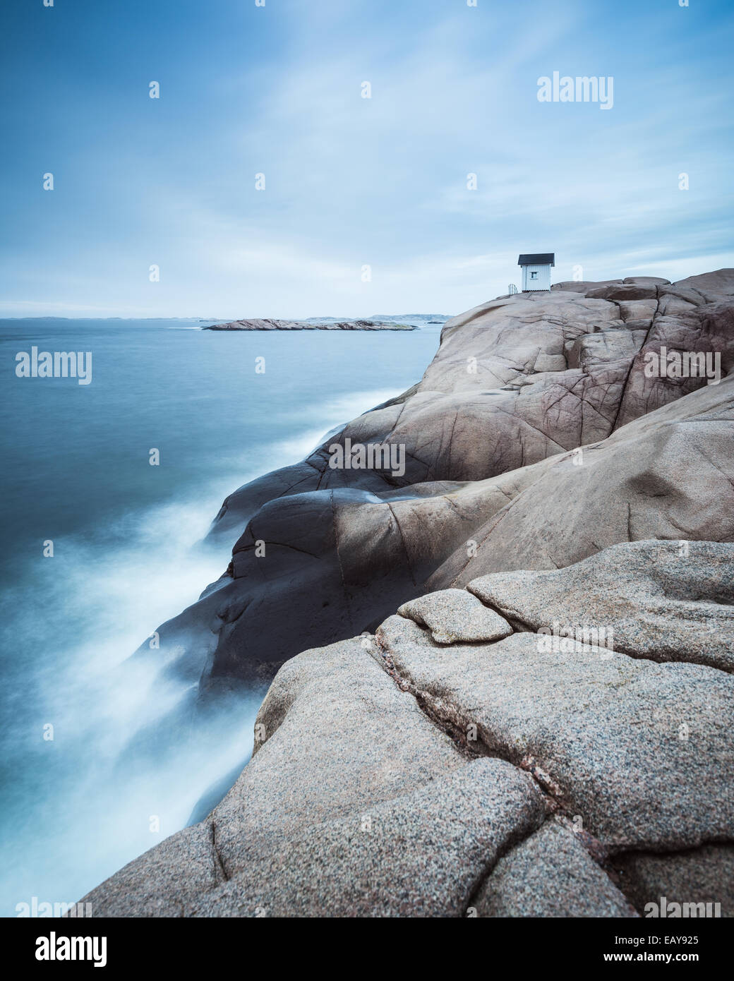 Cabin on cliff near sea with dramatic sky Stock Photo - Alamy