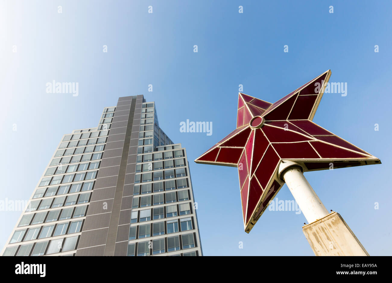 Modern office building and a ruby star Stock Photo - Alamy