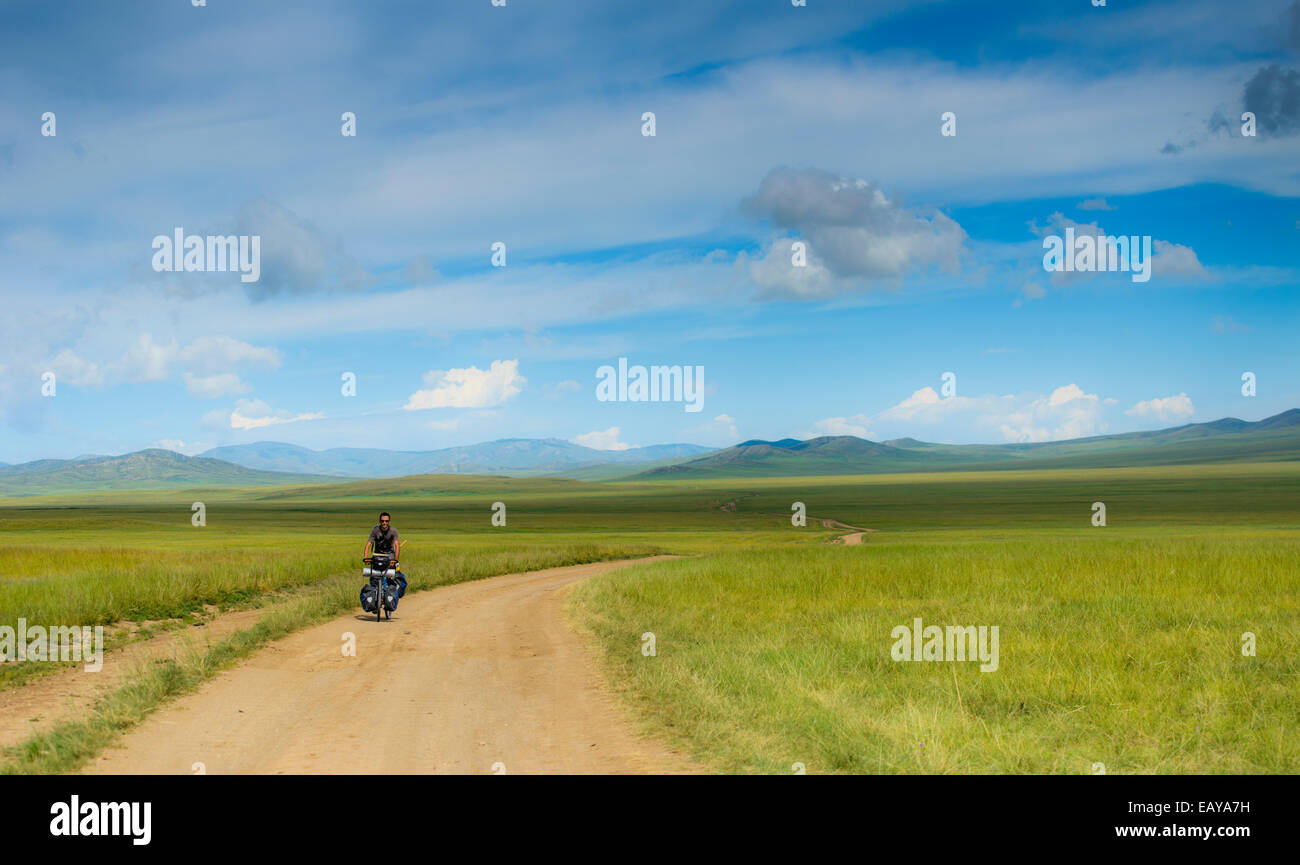 Man cycling through country road hi-res stock photography and images ...