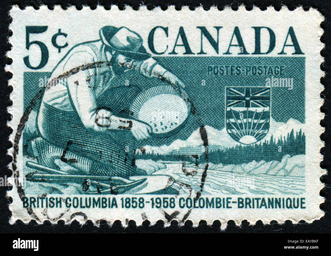 CANADA - CIRCA 1958: A stamp printed in Canada shows Miner Panning Gold ...