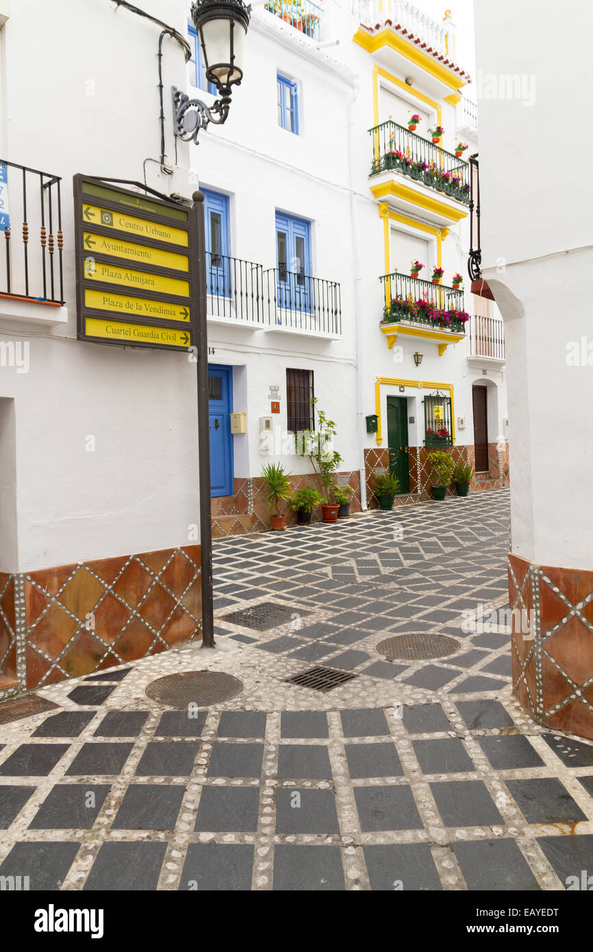 Tiled narrow streets in the Spanish white village of Competa on the ...