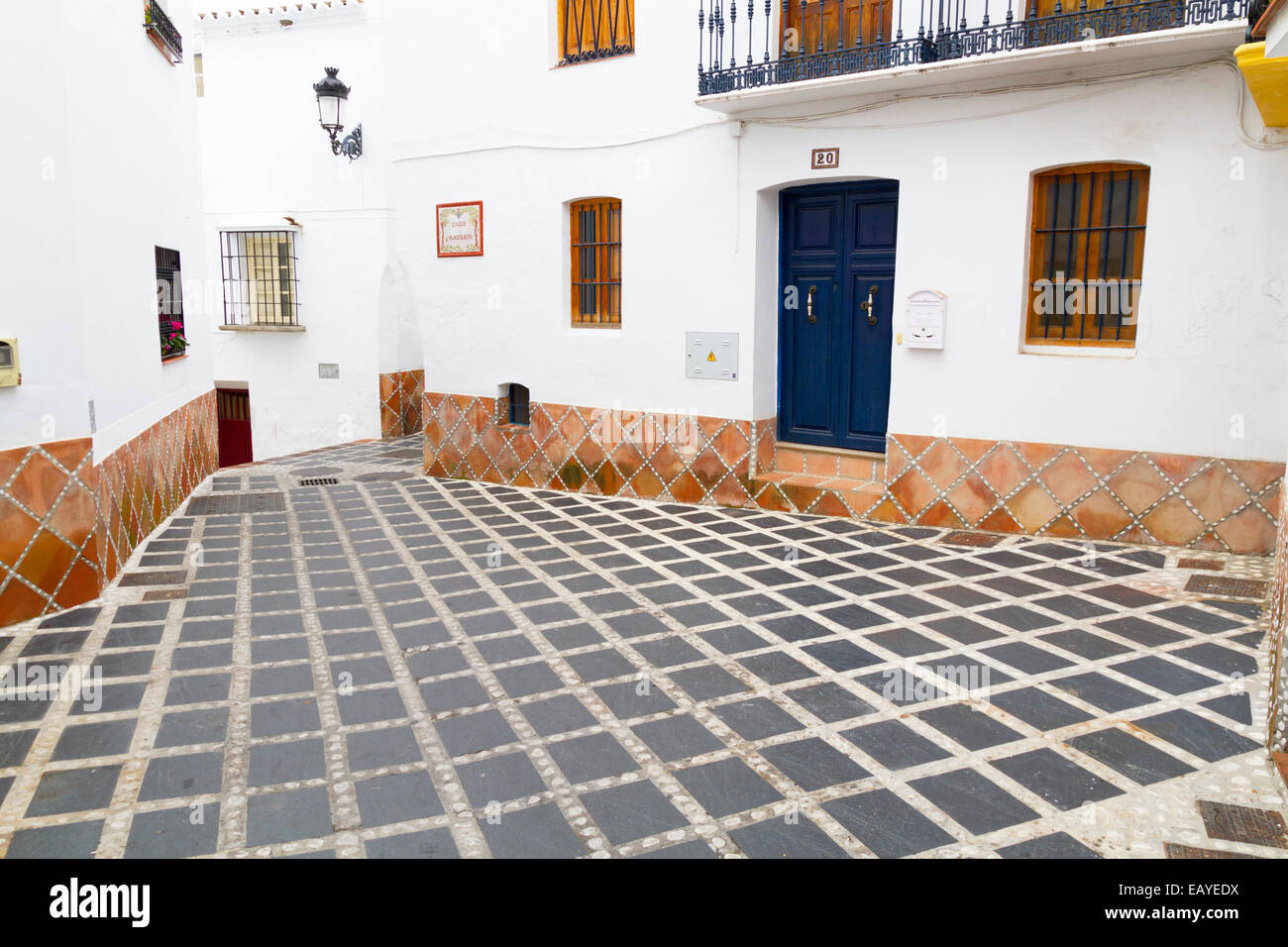 Tiled narrow streets in the Spanish white village of Competa on the ...