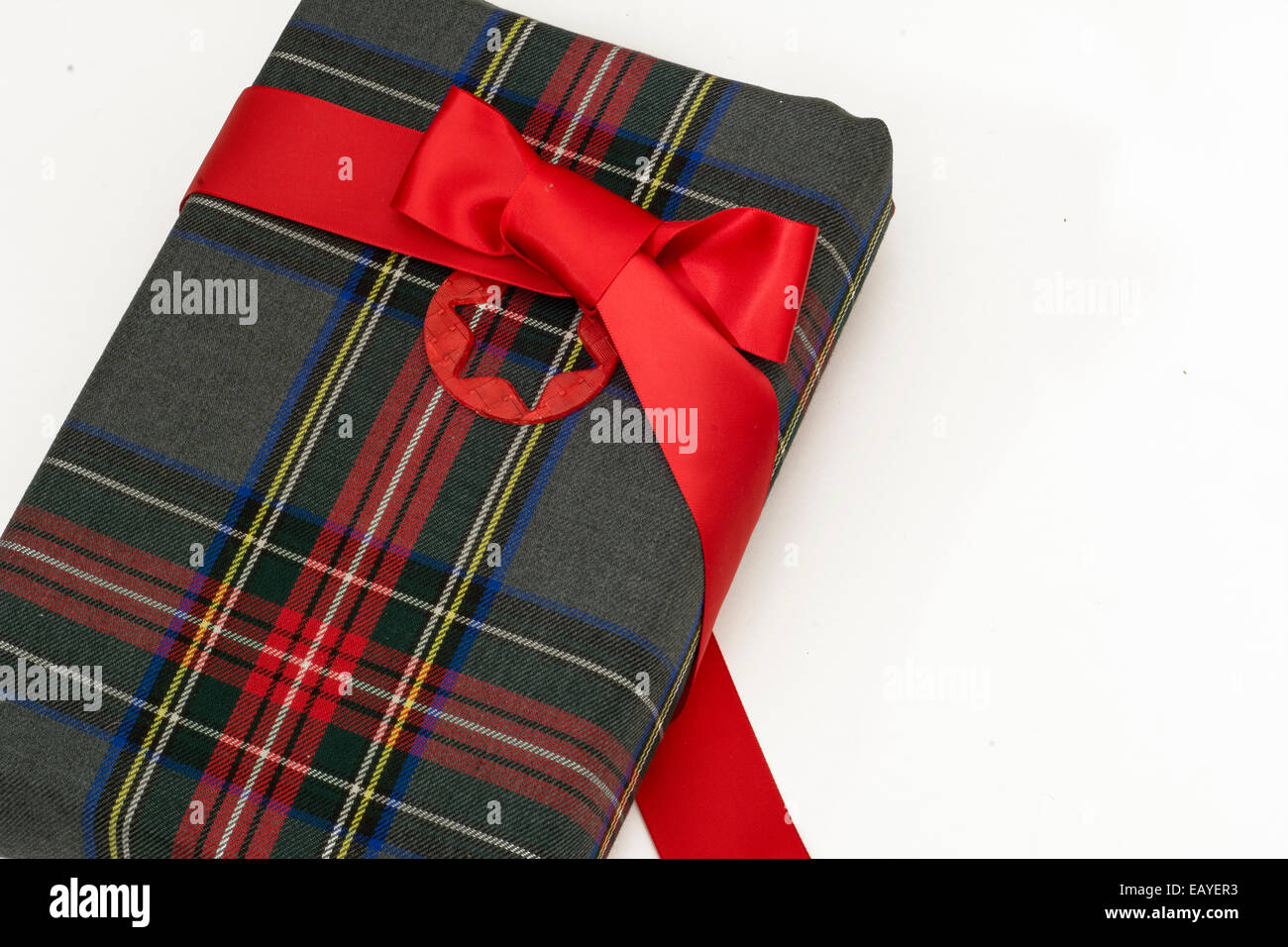present, wrapped in plaid, red tie and decorative star on isolated ...