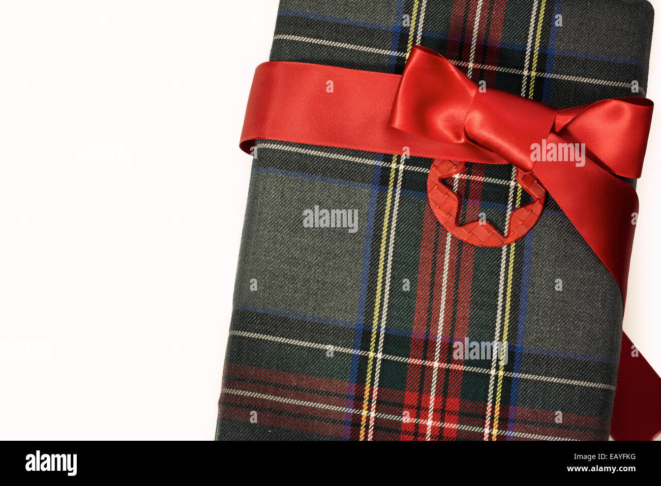 present, wrapped in plaid, red tie and decorative star on isolated ...