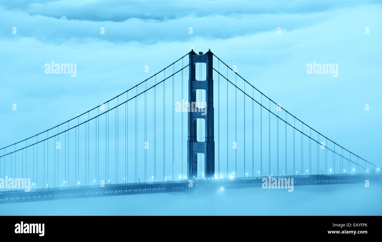 Golden Gate Bridge tower in fog closeup in San Francisco Stock Photo ...