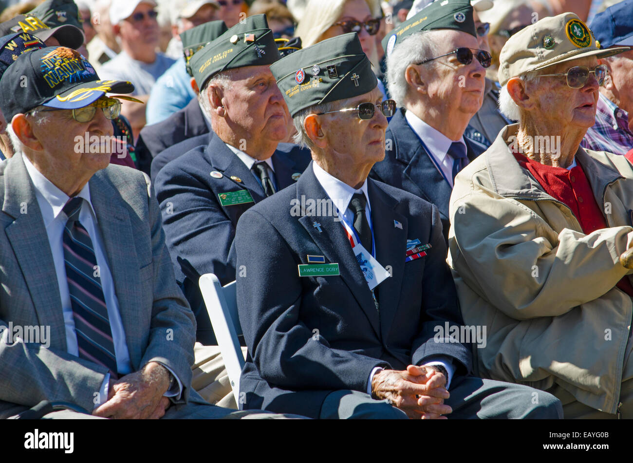 World War II Veterans give their attention during a speech dedicating a ...