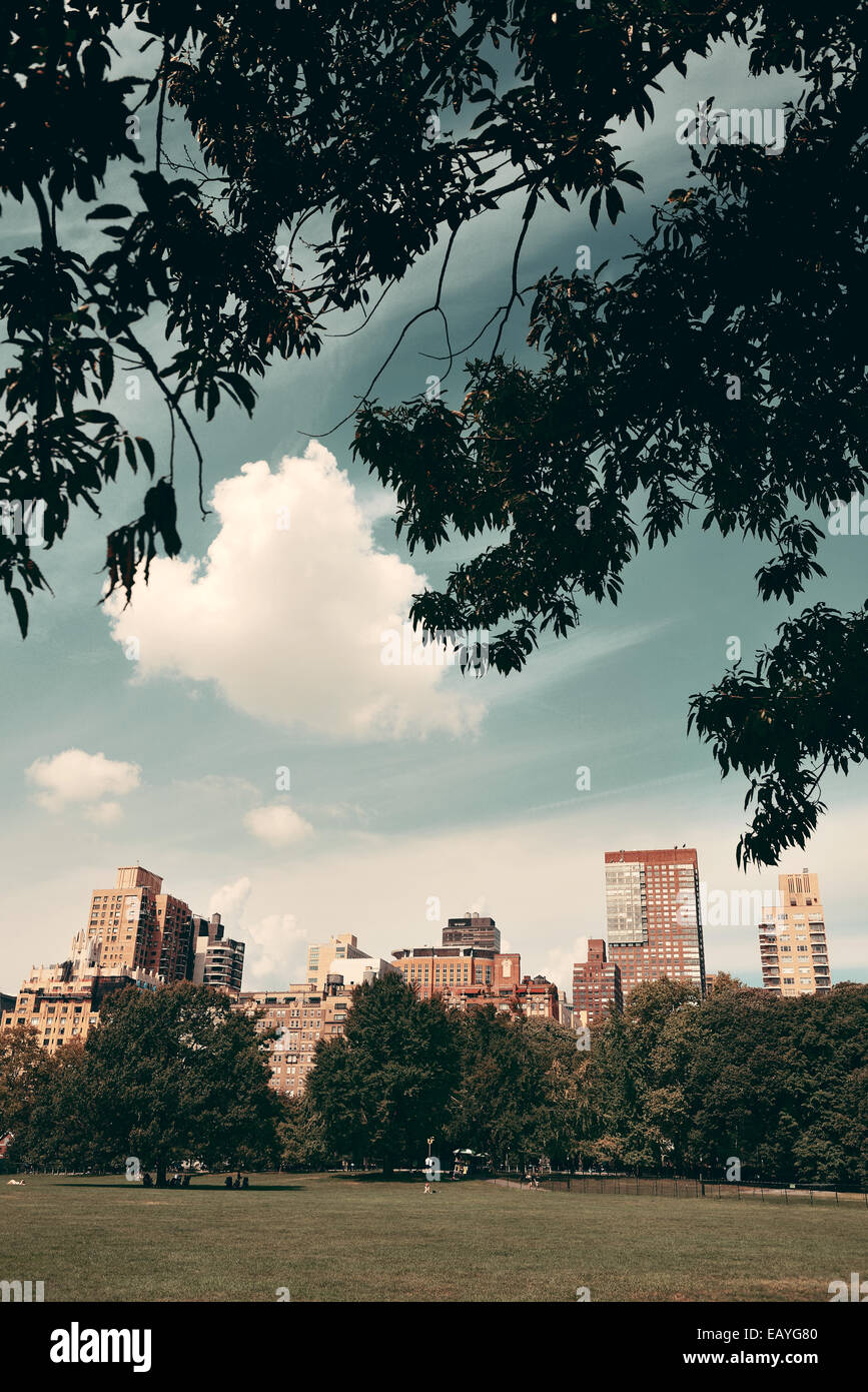 Central Park Spring with skyline in midtown Manhattan New York City ...