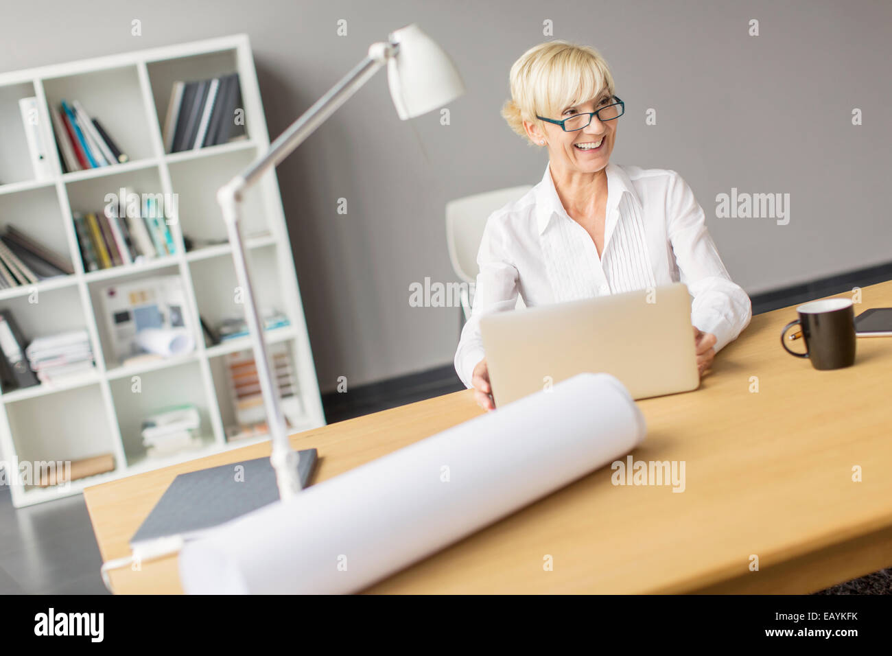 Woman working in the office Stock Photo - Alamy