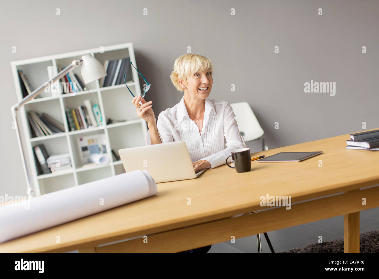 Woman working in the office Stock Photo - Alamy