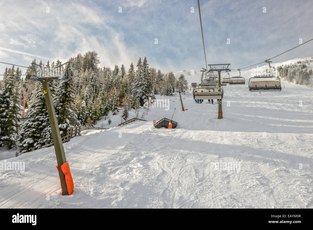 Winter landscape with chairlift and slope at alpine ski resort Stock ...