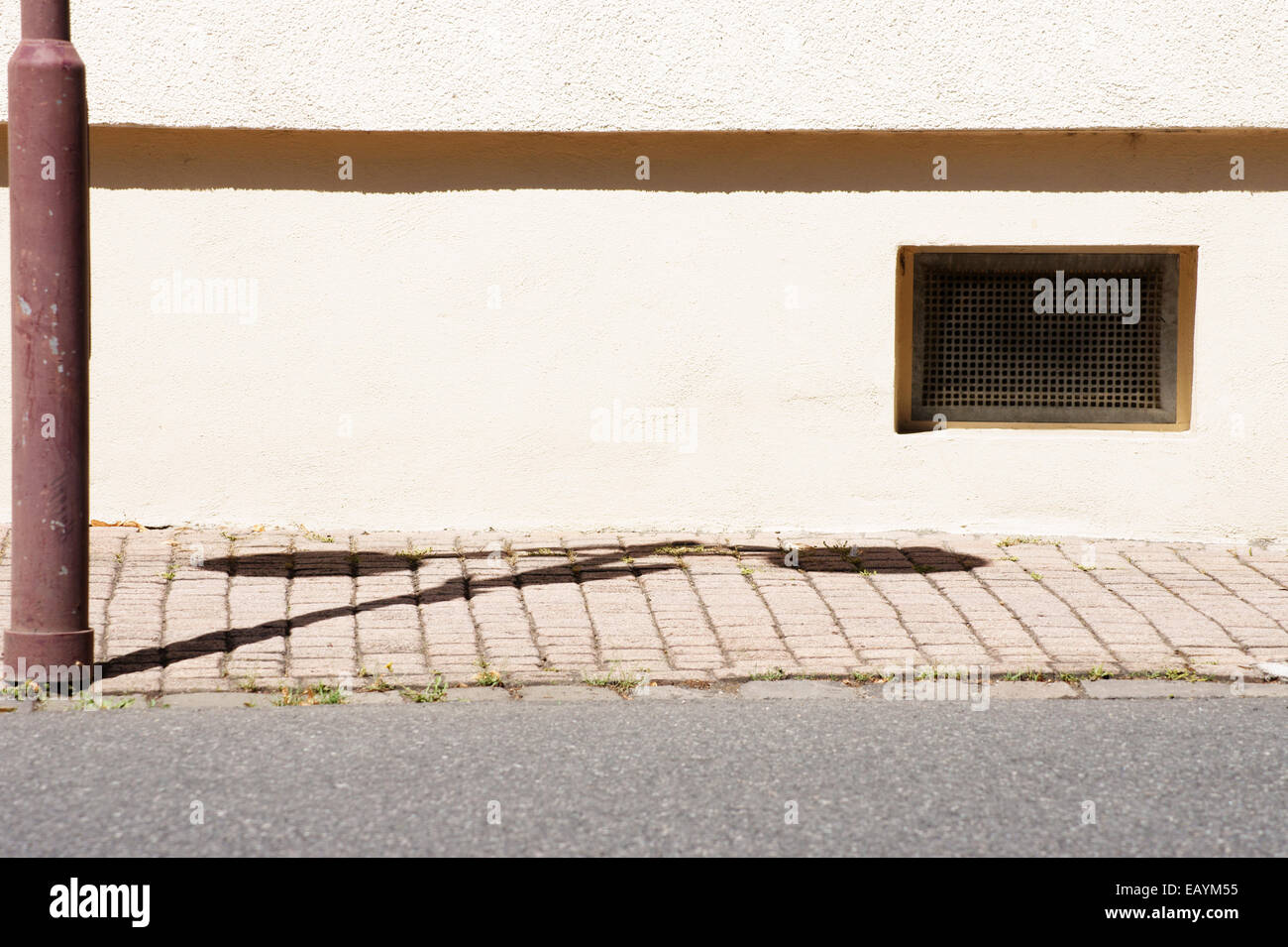 Basement window with lantern shade Stock Photo - Alamy