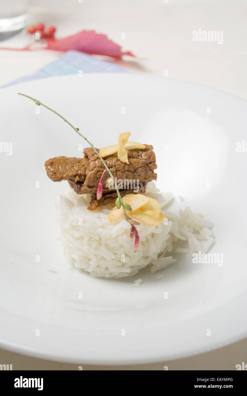 white rice with beef on wooden background Stock Photo - Alamy