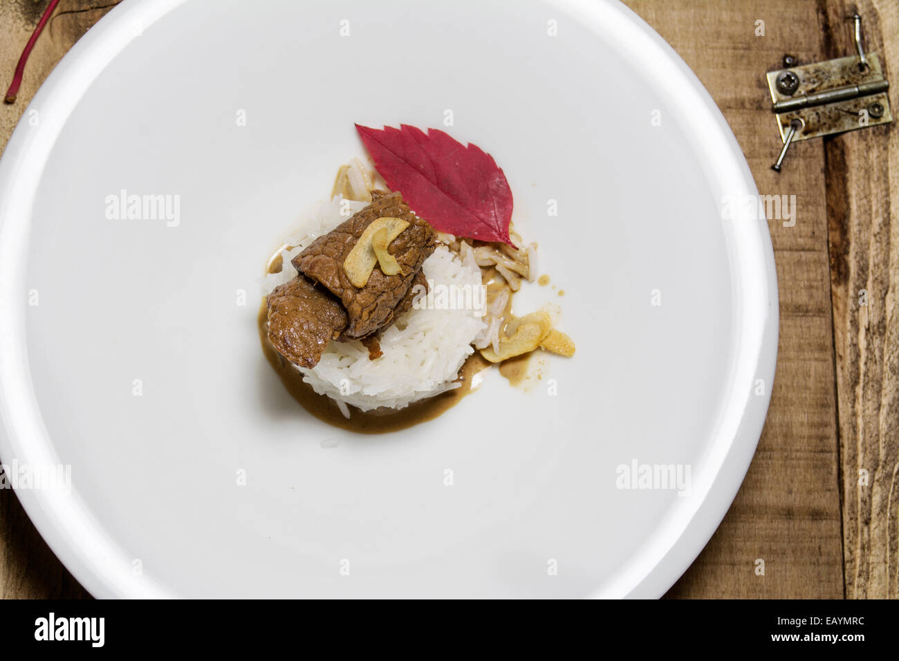 white rice with beef on wooden background Stock Photo - Alamy