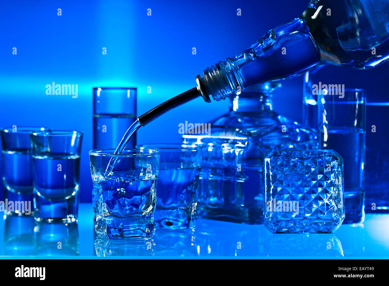 vodka in bar on a glass table Stock Photo - Alamy