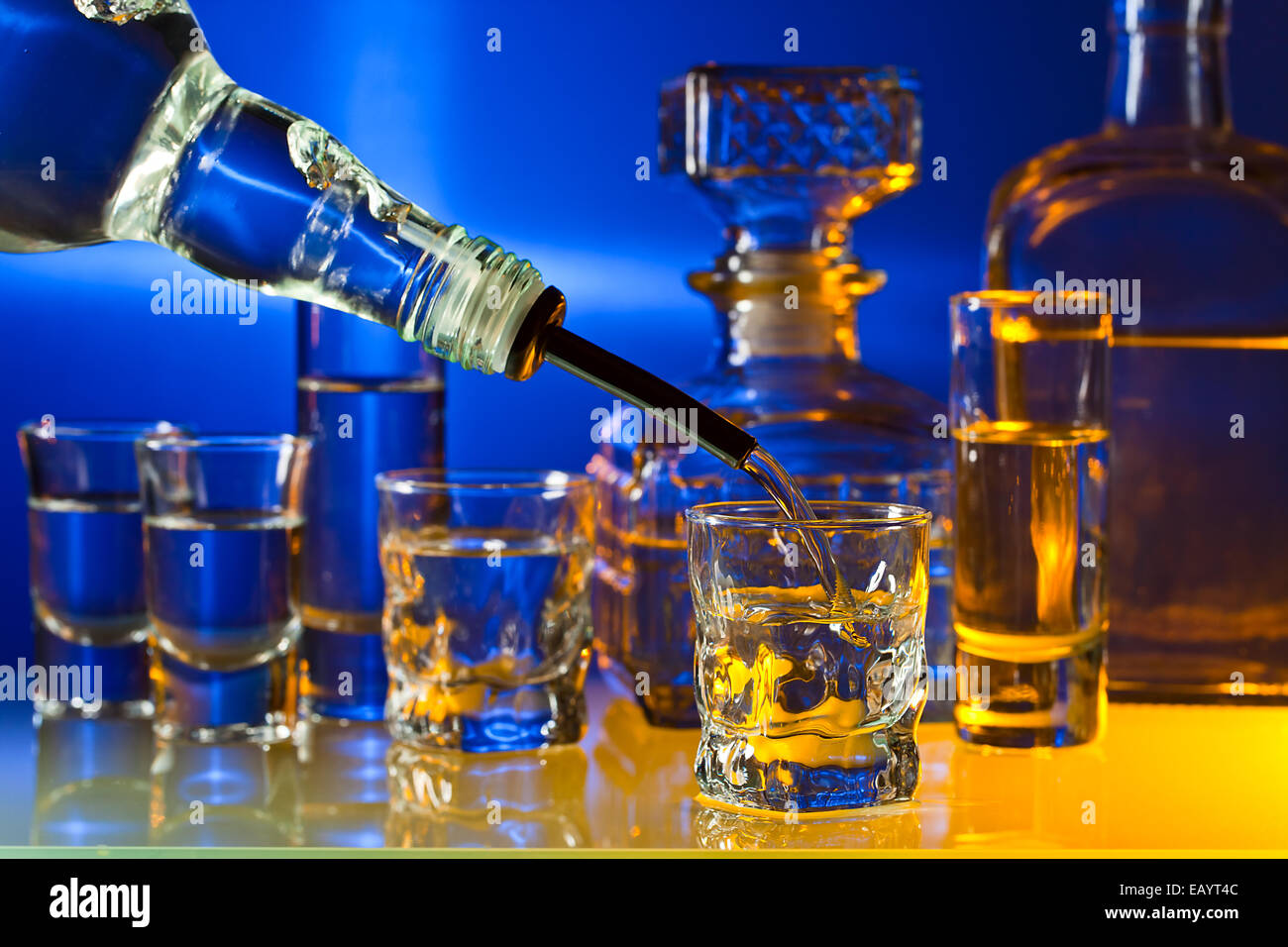 vodka in bar on a glass table Stock Photo - Alamy