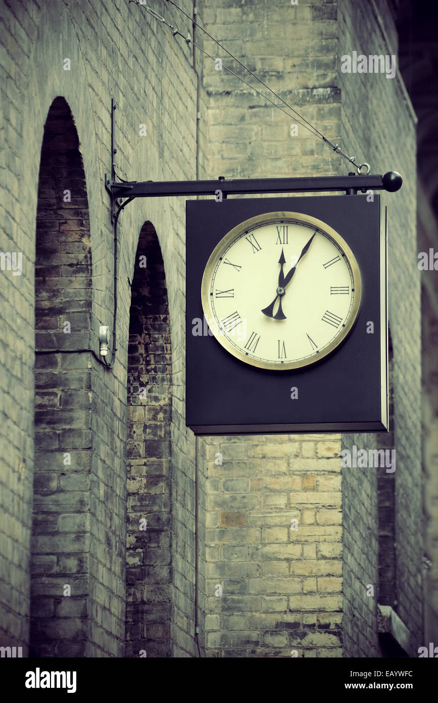 Urban historical architecture with vintage clock in street in London ...