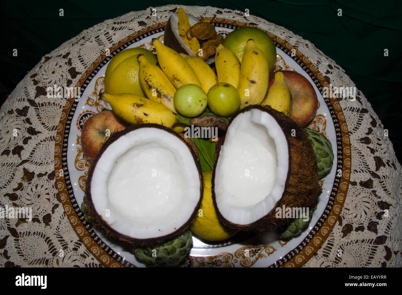 Indian custom of offering of various fruits and shells of broken ...