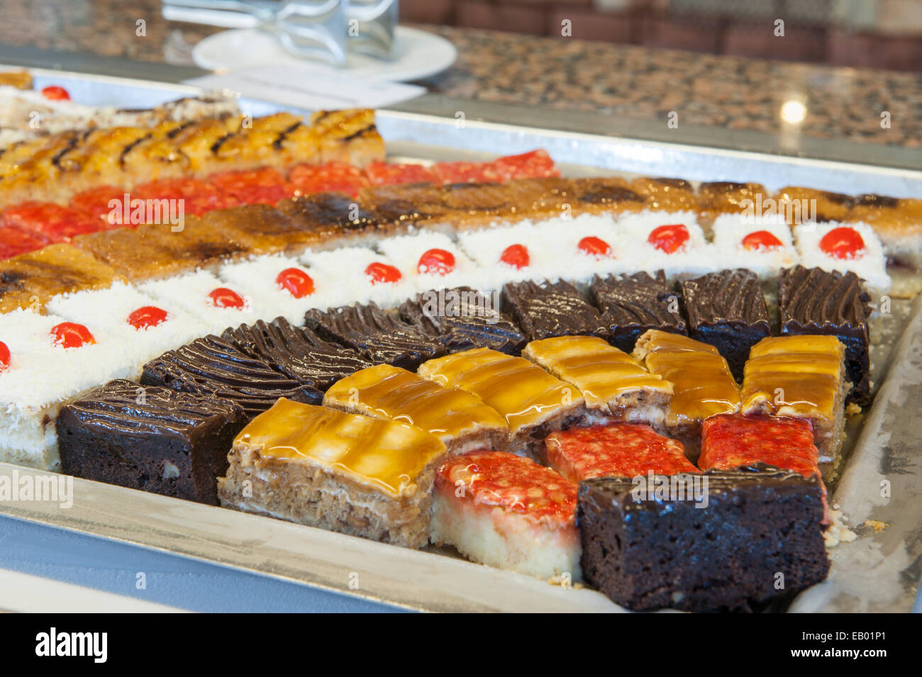 Closeup detail of a variety selection showing luxury cakes on tray ...