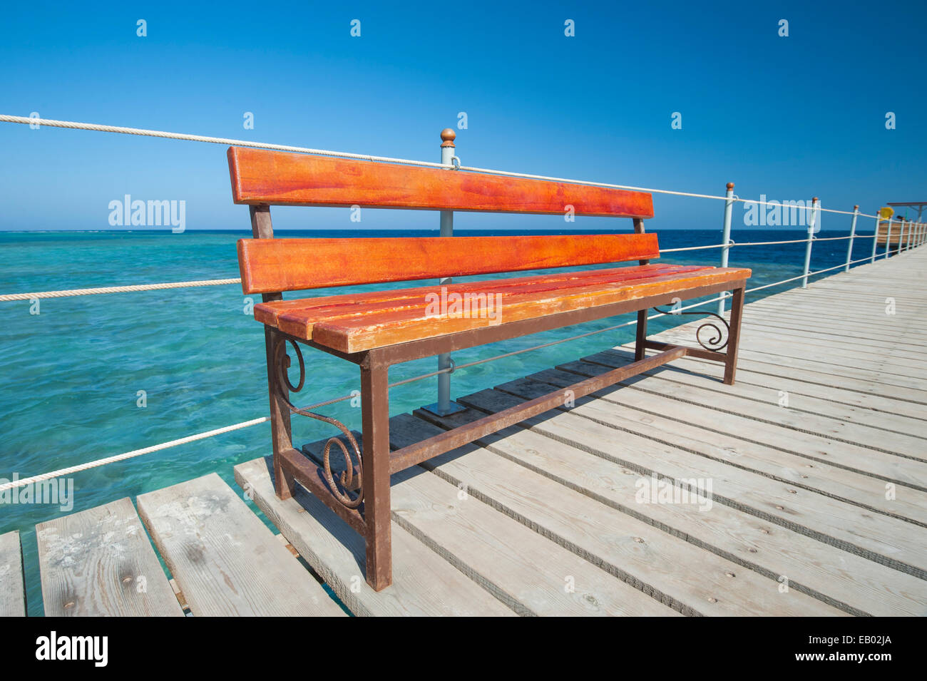 Wooden bench seat on jetty at tropical beach resort Stock Photo - Alamy