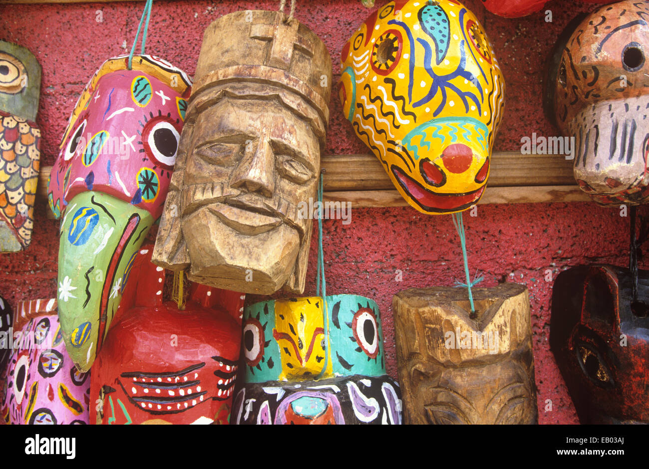 Hand-carved masks on display at a market, Guatemala, Central America ...
