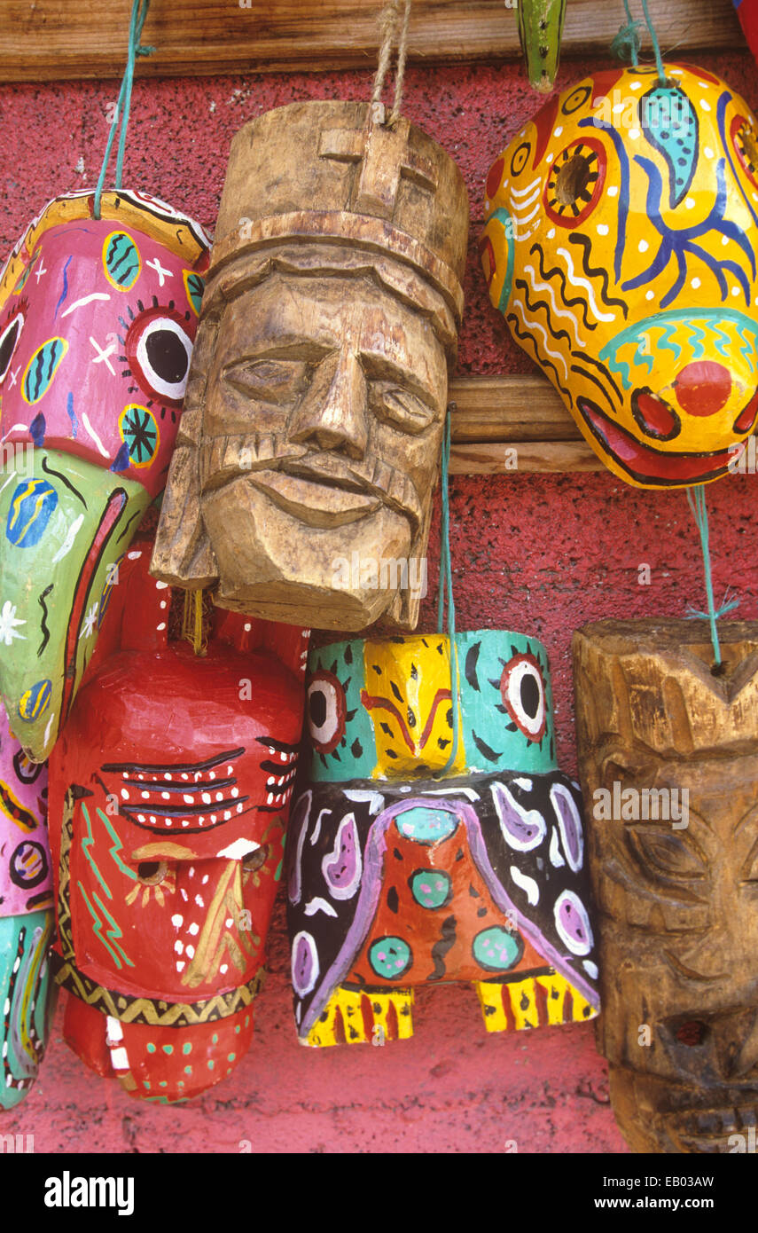 Hand-carved masks on display at a market, Guatemala, Central America ...