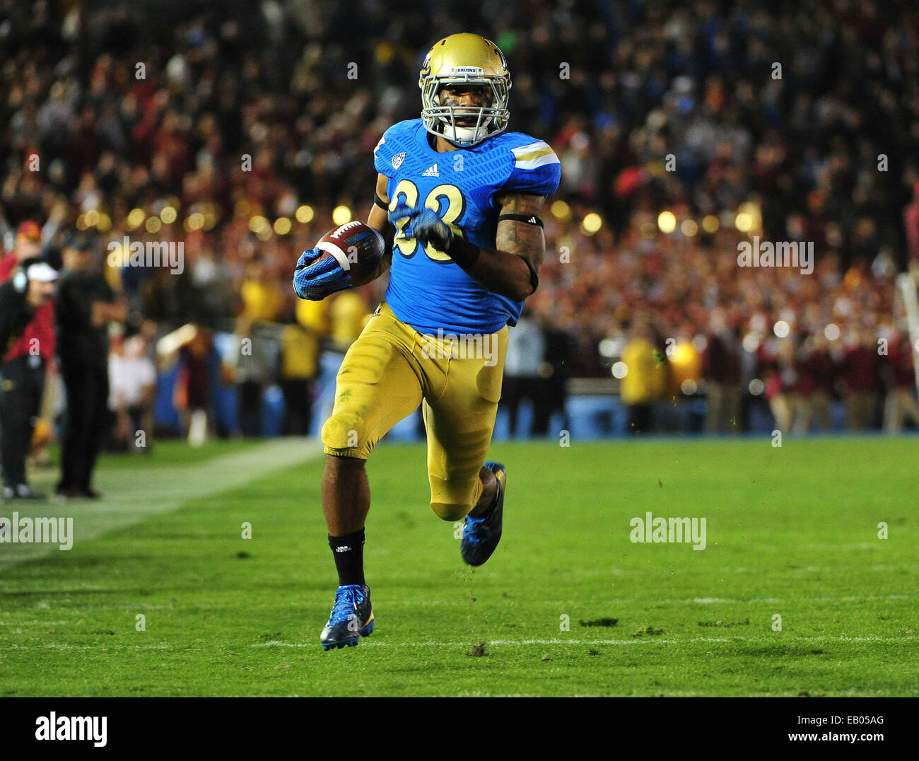 Novomber 22, 2014 Pasadena, CA: Nate Starks #22 runs of the Bruins ...
