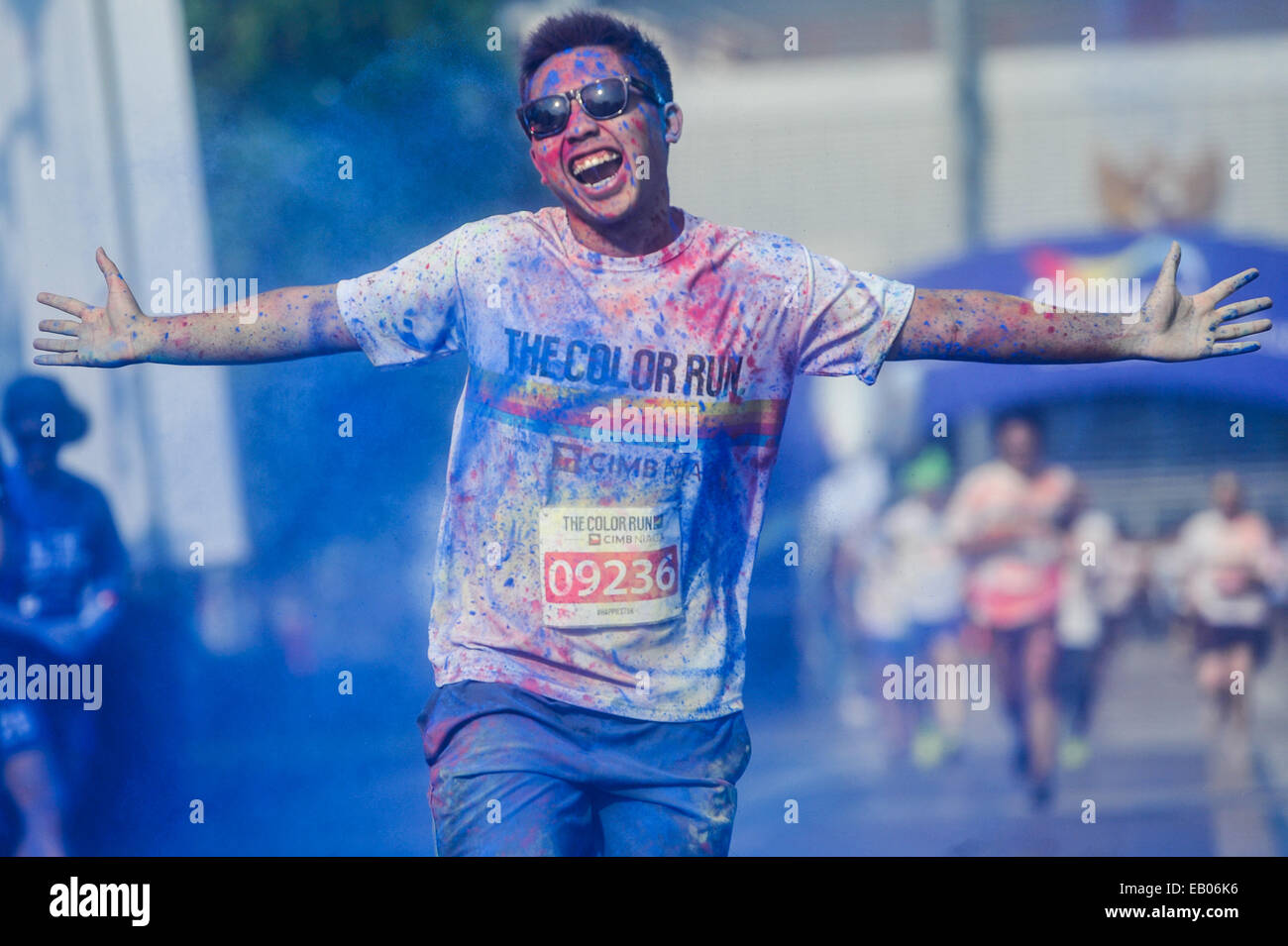 Jakarta, Indonesia. 23rd Nov, 2014. A runner participates in a color ...