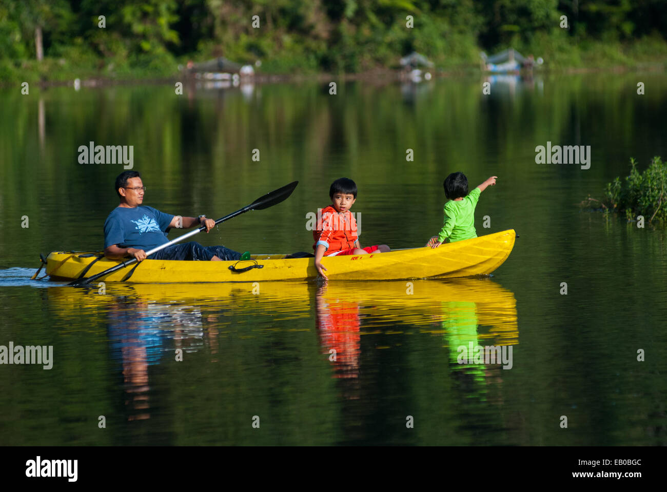 Family canoeing at Situgunung lake, Gede Pangrango National Park ...