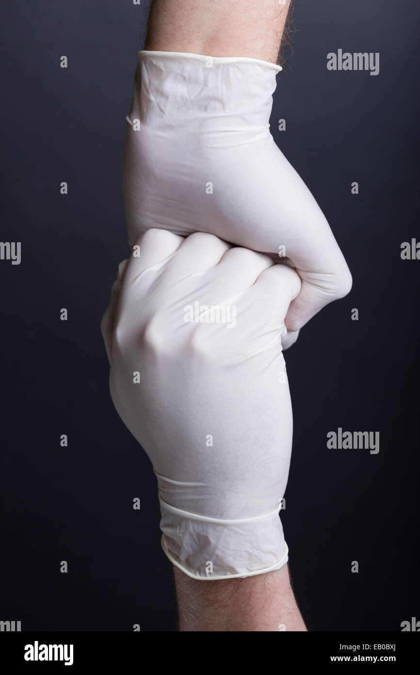 Male doctor in sterile gloves hi-res stock photography and images - Alamy