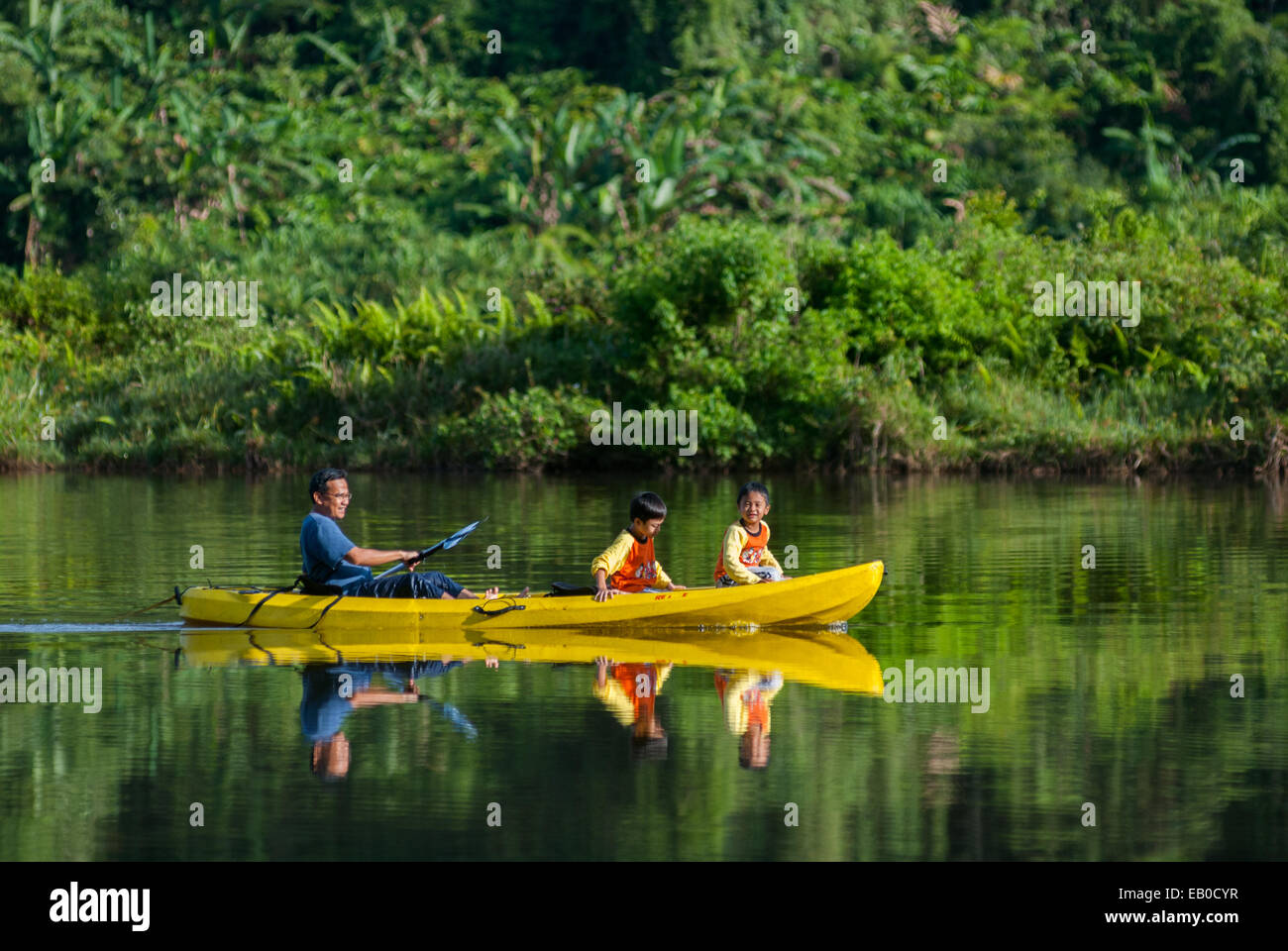 Family canoeing at Situgunung lake, Gede Pangrango National Park ...