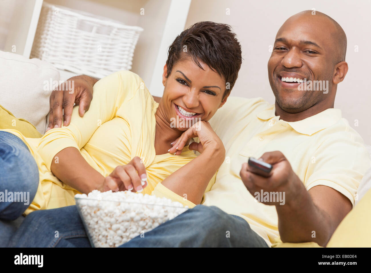 Beautiful woman using tv remote hi-res stock photography and images - Alamy