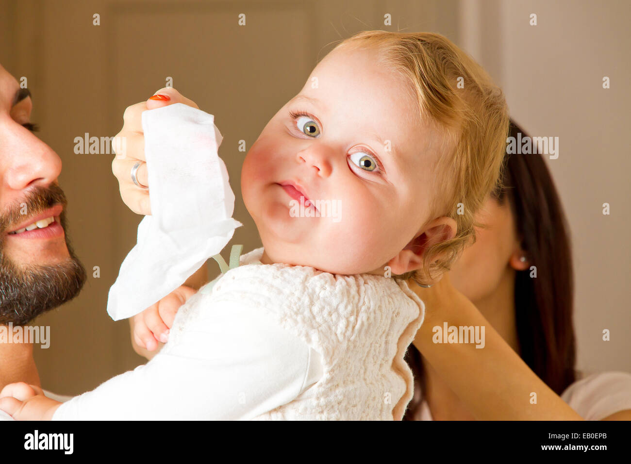 Baby with tissue Stock Photo - Alamy