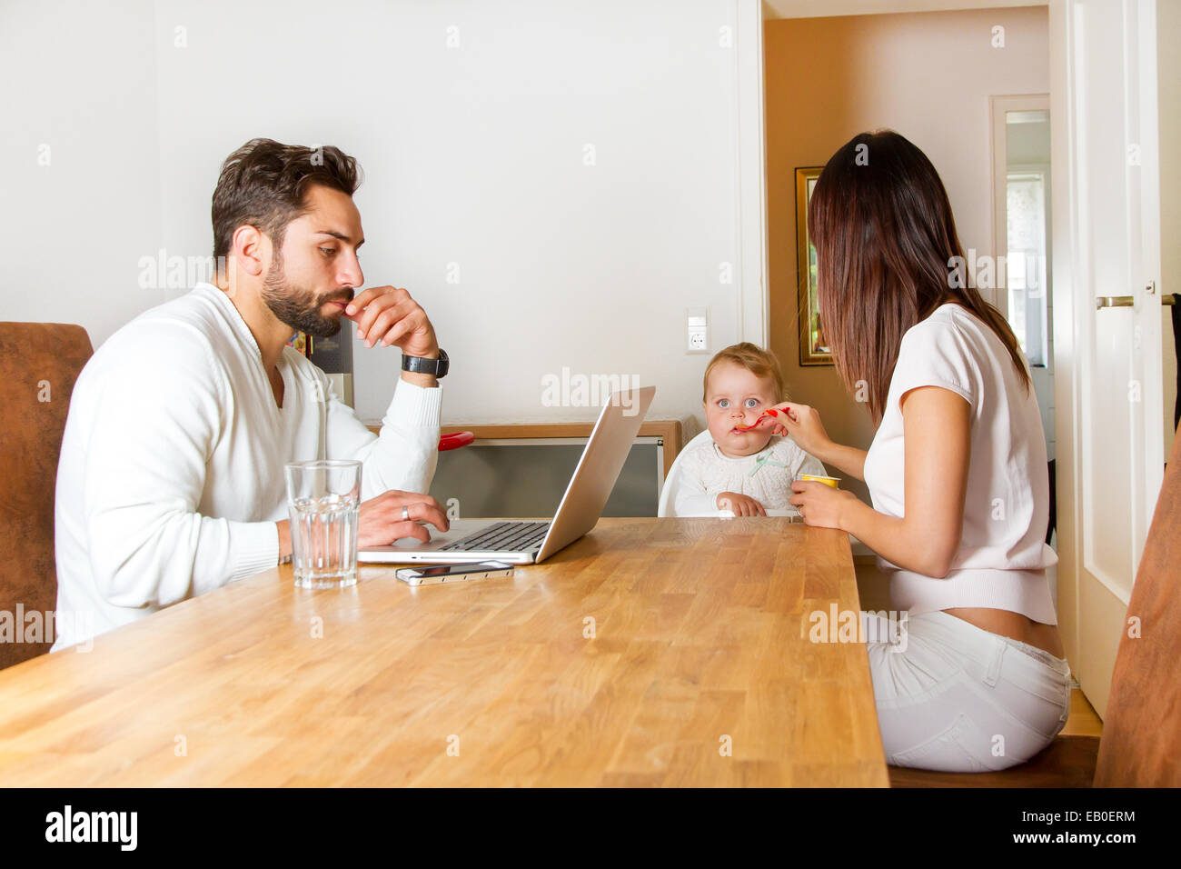 Family together at home - typical gender role Stock Photo - Alamy