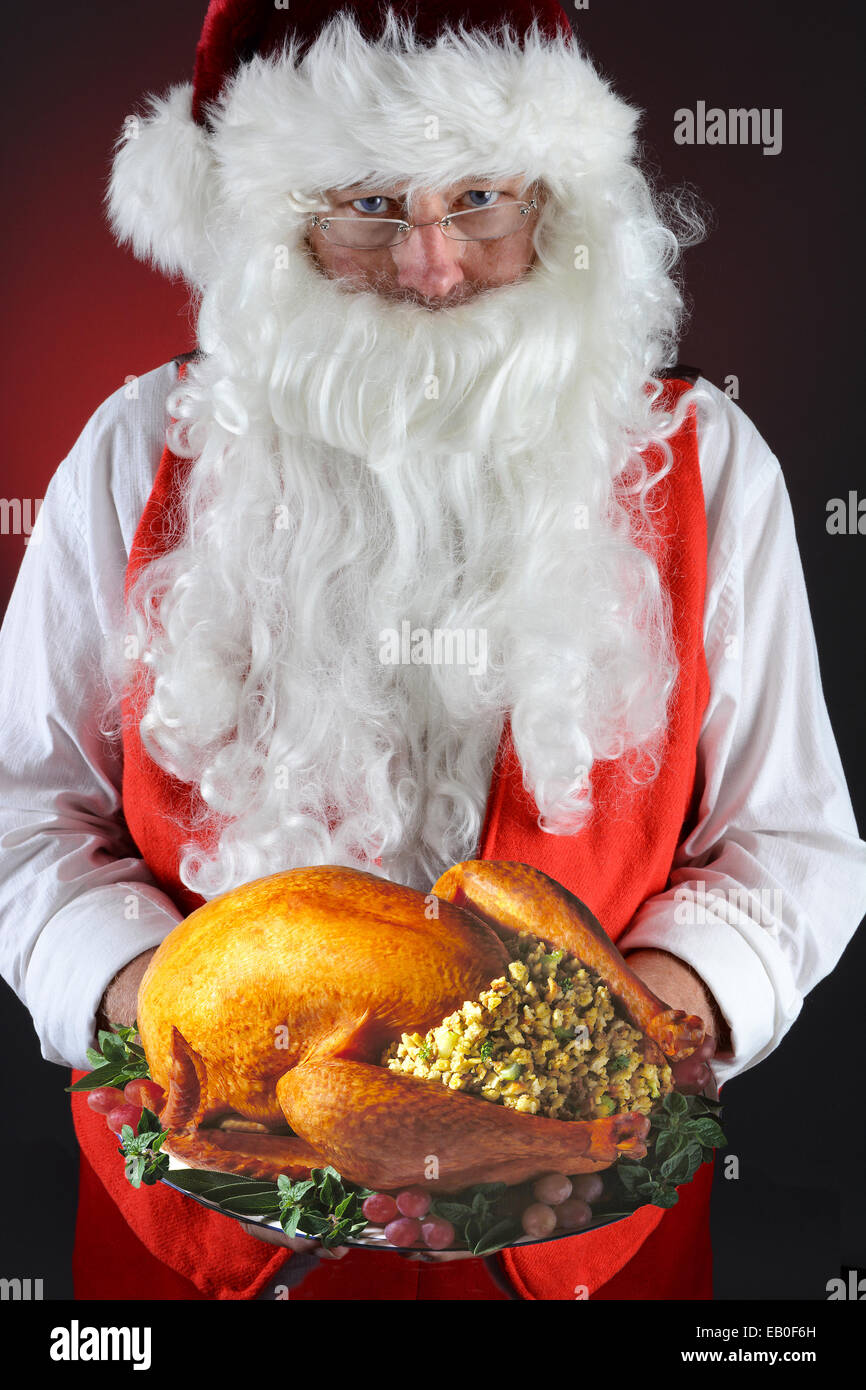 Santa Claus serving a fresh Roasted Thanksgiving or Christmas Turkey ...
