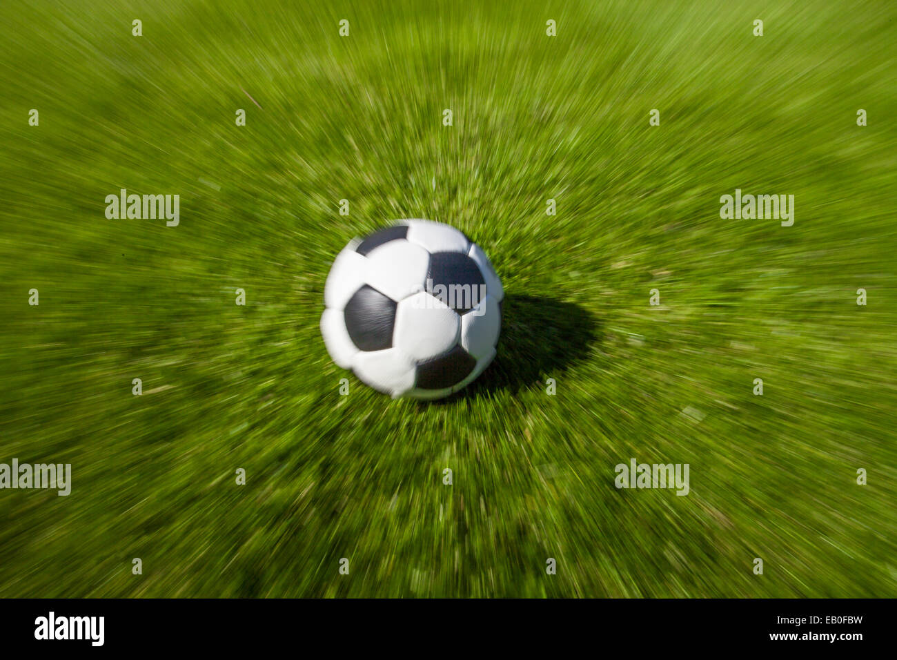 focus on soccer ball (radial blur effect Stock Photo - Alamy