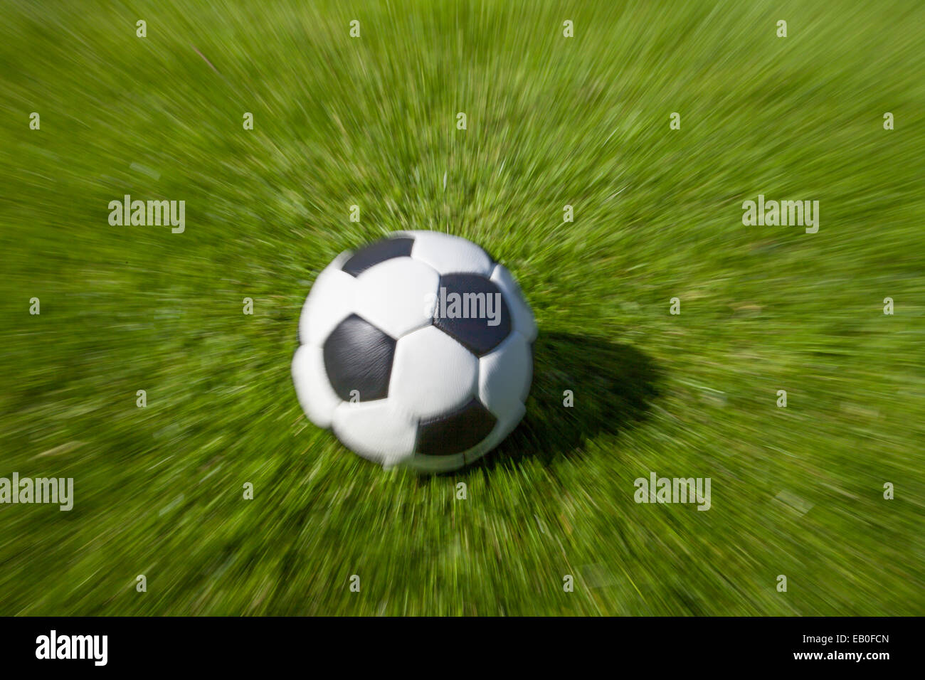 football in action on field Stock Photo - Alamy